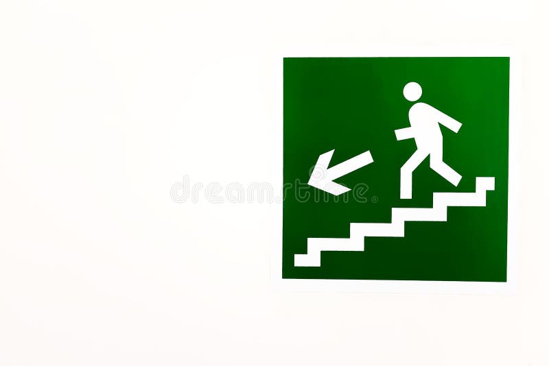 Green Sign Down the Stairs on an Empty Bright Wall Stock Photo - Image ...
