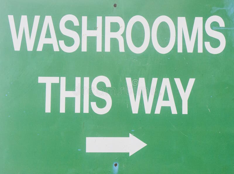 Green Sign Pointing Way To Washrooms Stock Image - Image of bathroom ...