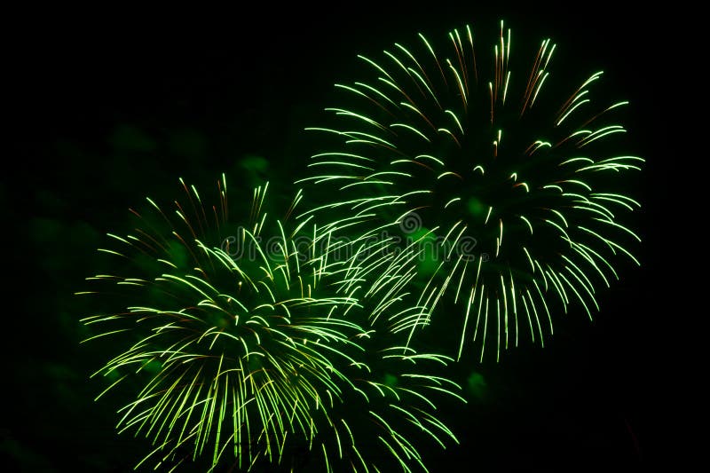 Green and Silver Bright Sparks of Fireworks on the Black Sky Stock ...