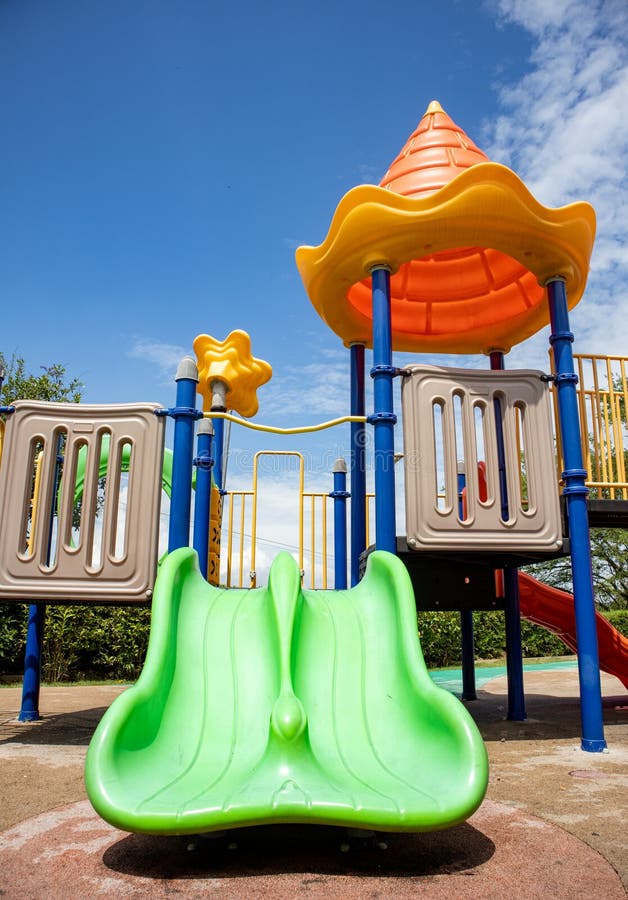 Green Slide on a Backyard Playground Stock Image - Image of blur ...