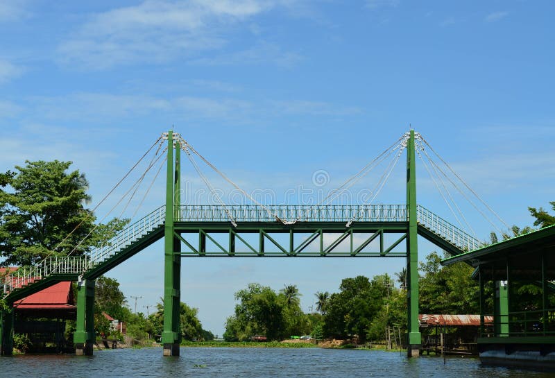 Green Sling Iron Bridge Over Canal and Blue Sky Stock Image - Image of ...