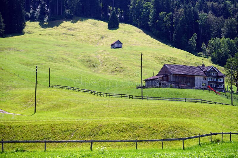 Green slope and mount stock photo. Image of tree, fence - 76965562