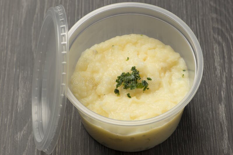 Green Smelling Mashed Potatoes in Plastic Container Stock Image - Image ...