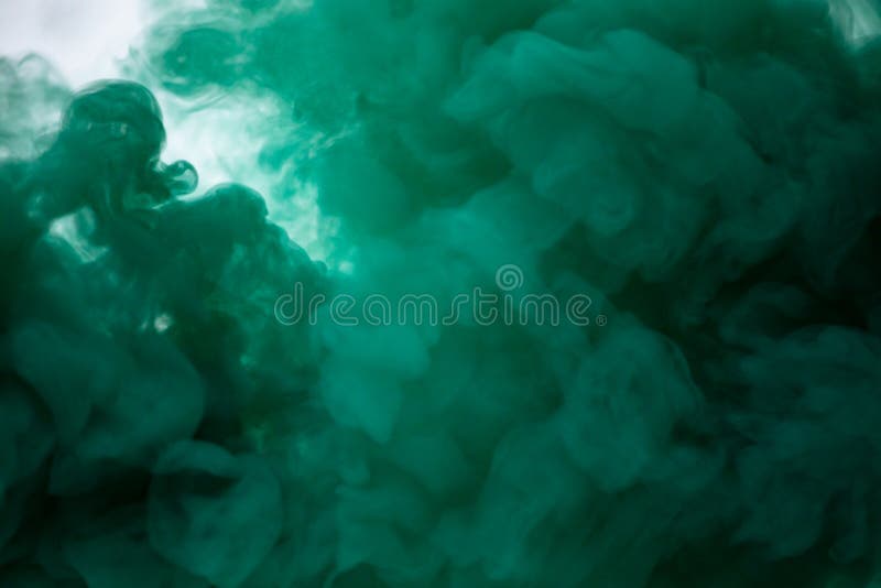Green Smoke Bomb Exploding Against White Background Stock Photo - Image ...