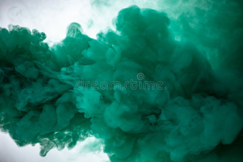 Green Smoke Bomb Exploding Against White Background Stock Image - Image ...