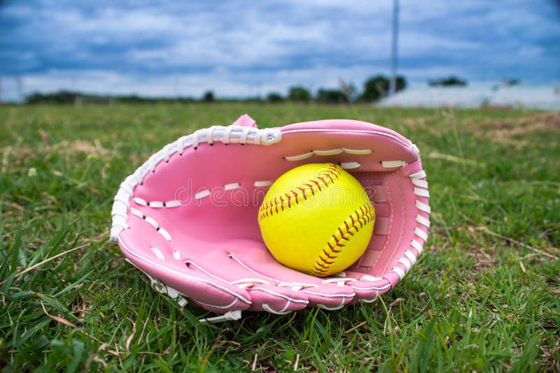 Green Softball in Pink Softball Glove on Field Stock Photo - Image of ...