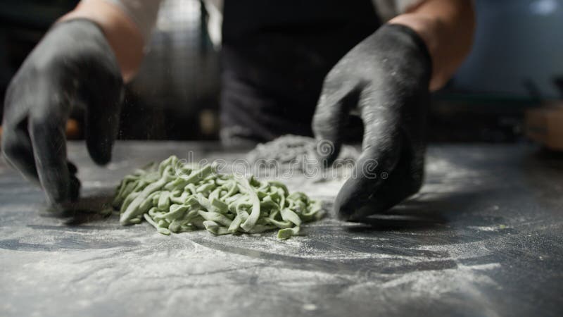 Green Spaghetti in the Working Hands of a Chef Stock Photo - Image of ...