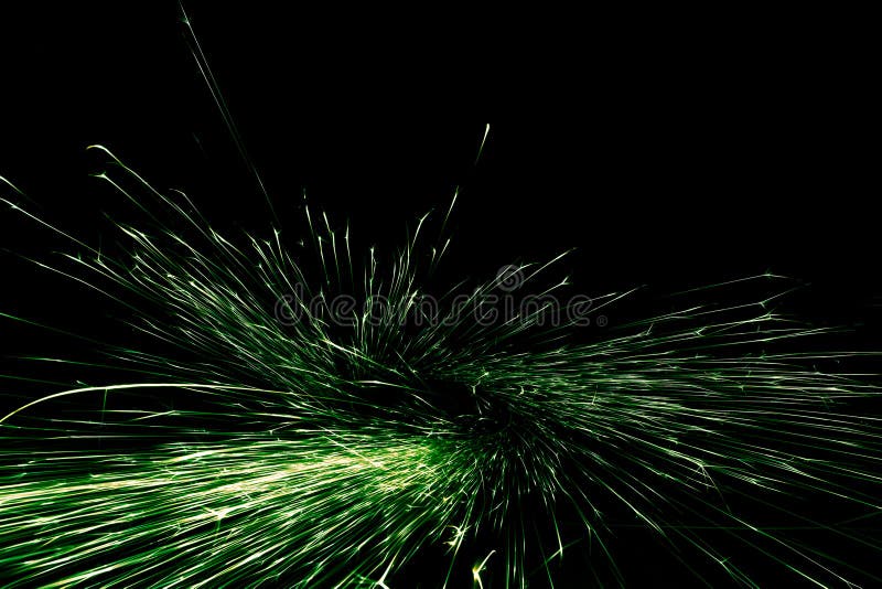 Green Sparks from the Grinder Glowing in the Dark Stock Photo - Image ...