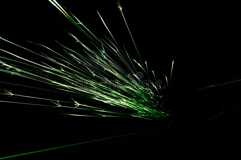 Green Sparks from the Grinder Glowing in the Dark Stock Photo - Image ...