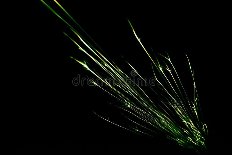 Green Sparks from the Grinder Glowing in the Dark Stock Photo - Image ...