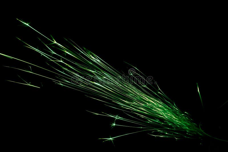 Green Sparks from the Grinder Glowing in the Dark Stock Photo - Image ...