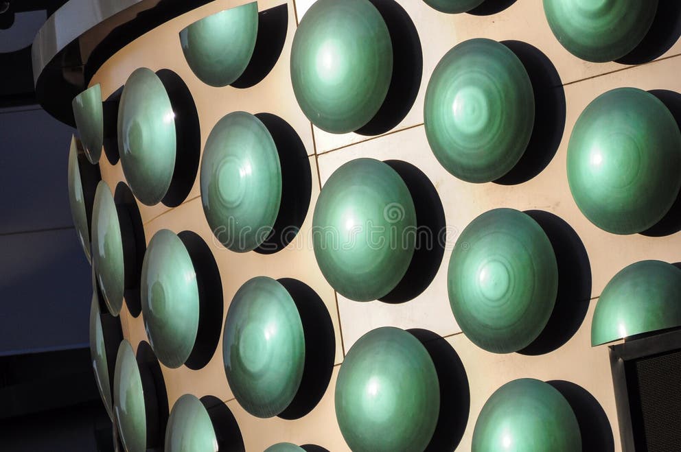 Green Spherical Architecture Elements Casting Shadows on Building ...