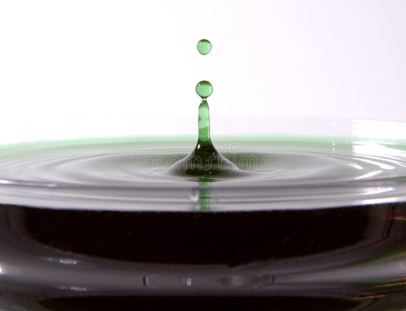 Green splash stock image. Image of frozen, dribble, reflection - 1044189