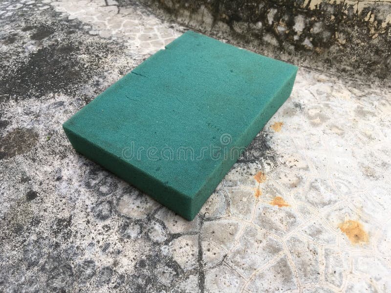 Green Sponge on Cement Floor Stock Photo - Image of sponge, tool: 84319316