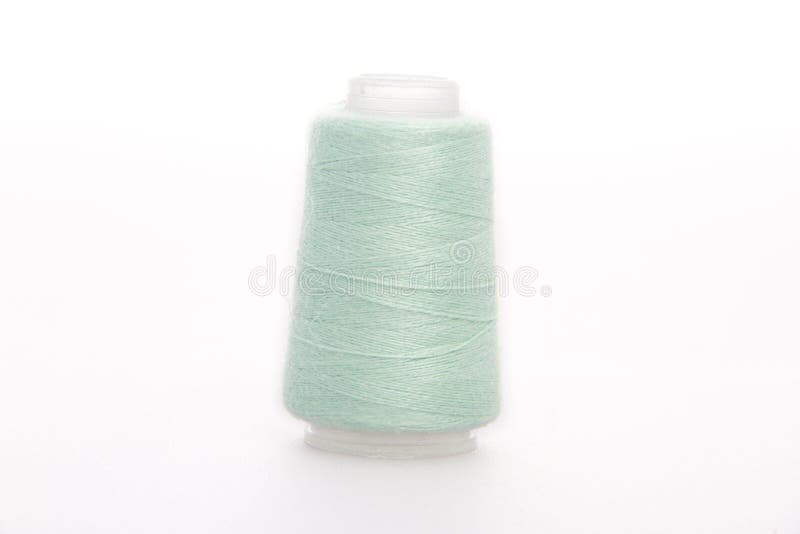 Green Spool of Thread Isolated on White Background. Skein of Woolen ...