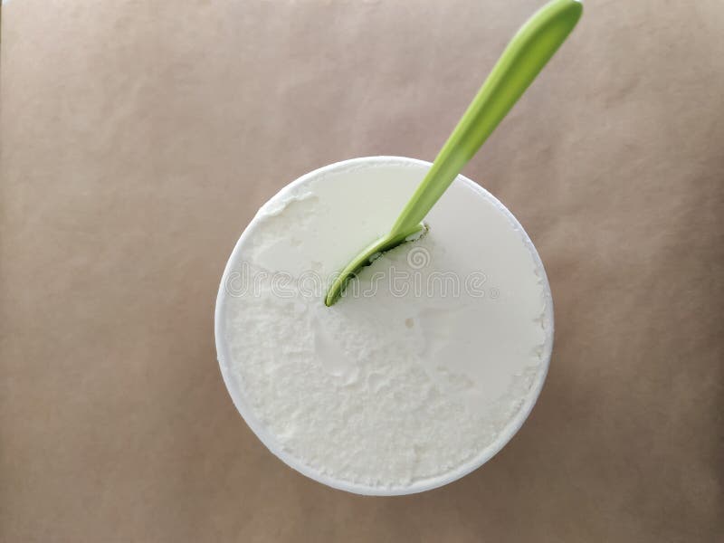 Green Spoon in Vanilla Ice Cream Stock Photo - Image of icing, dessert ...