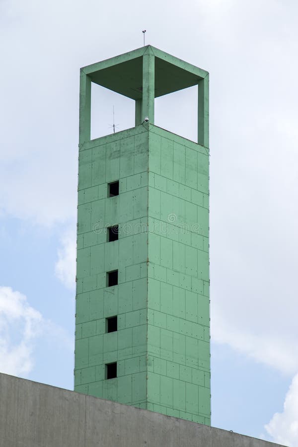 Green Square Geometric Concrete Tower with Cloudy Sky As Background ...