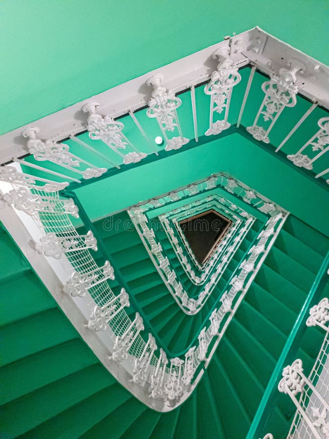 Green Staircase and White Railing with Green Wall Behind it and Some ...