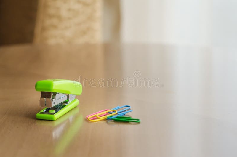 Green Stapler and Paper Clip Stock Image - Image of bind, iron: 49659497