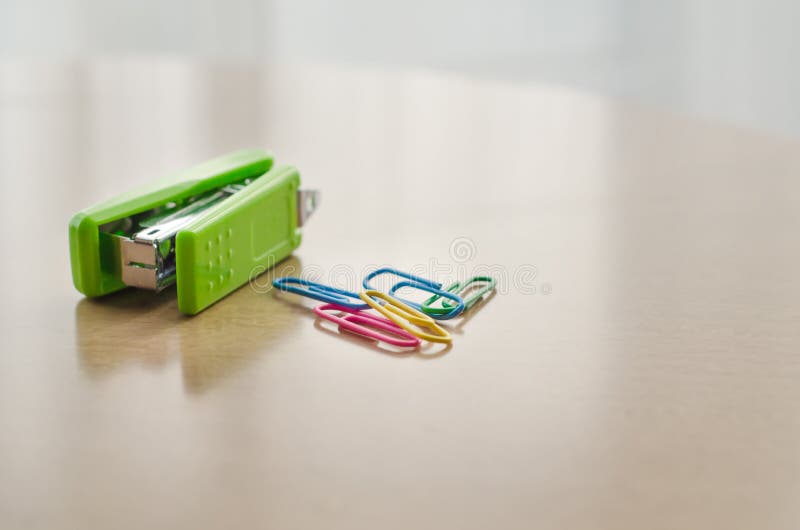 Green Stapler and Paper Clip Stock Image - Image of handy, iron: 49627573