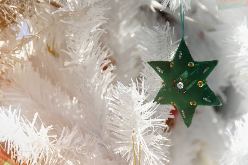 Green Star Decorative Hanging Element on White Christmas Tree Stock ...