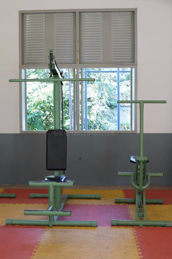 Green Steel Exercise Machine Inside Gym Room for Exercise. Stock Image ...