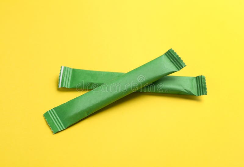 Green Sticks of Sugar on Yellow Background Stock Image - Image of small ...