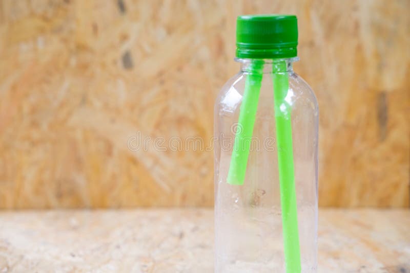Green Straws Inside a Transparent Bottle Stock Photo - Image of ...