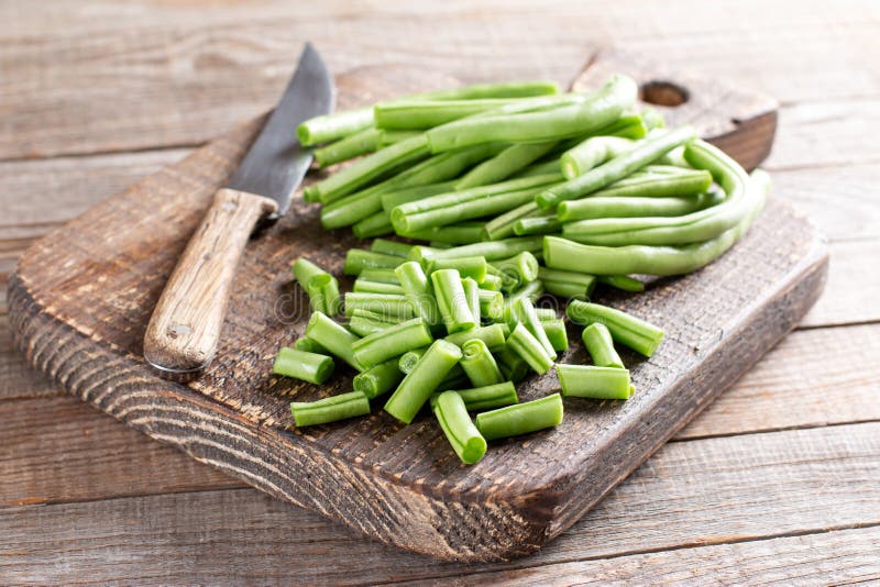 Green String Beans, Green Beans Slices on a Cutting Board on a Wooden ...