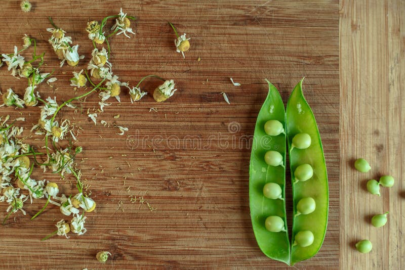 Green String of Peas on Wooden Kitchen Stock Image - Image of string ...