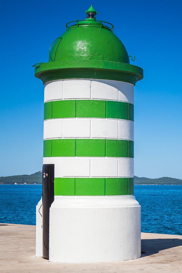 Green striped lighthouse stock photo. Image of sunny - 172653382