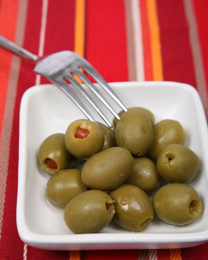 Green stuffed olives stock image. Image of fork, vertical - 6379211