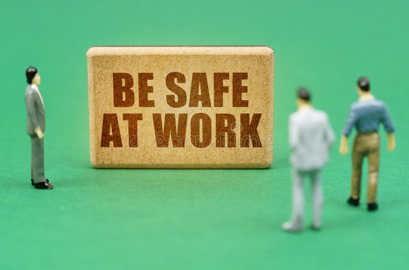 On the Green Surface are Figures of People and a Sign with the ...