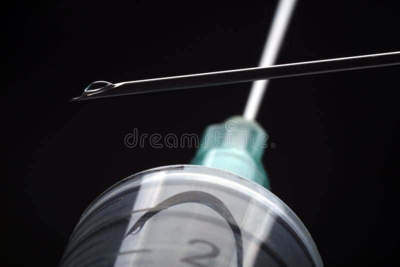 Green Syringe on Black Background Stock Photo - Image of instrument ...