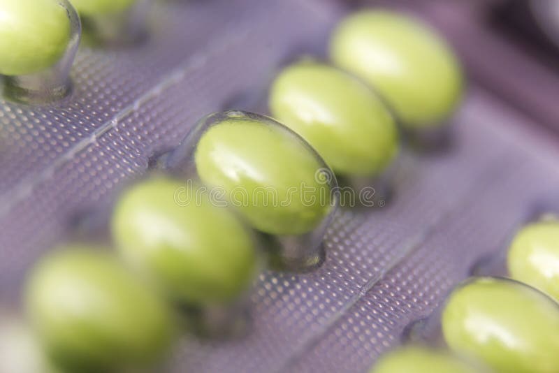 Green tablets stock photo. Image of macro, pack, container - 50971416