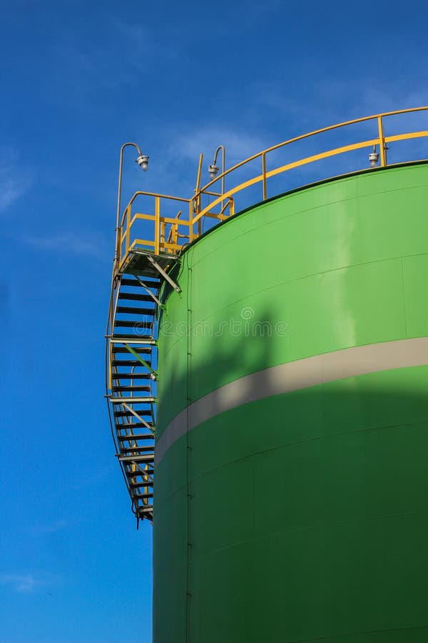 A Green Tank with a Yellow Ladder on Top Stock Image - Image of tank ...