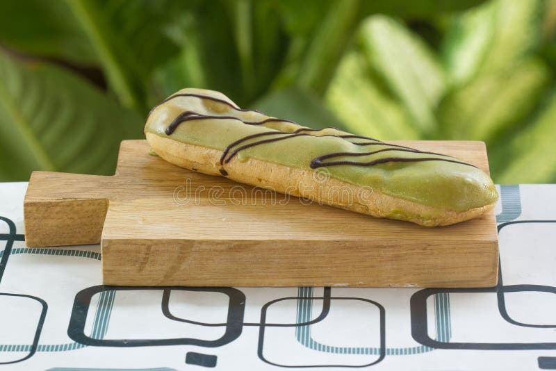 Green Tea coating Eclair stock image. Image of break - 76693341