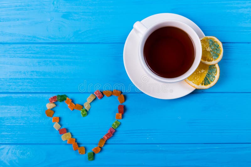 Green Tea with Heart Shape Over Blue Background. Top View with Teacup ...
