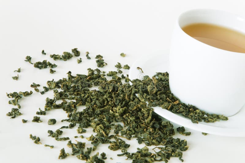Green Tea Leaves and White Cup Stock Image - Image of macro, closeup ...