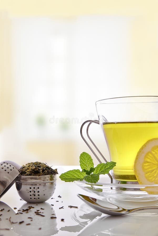 Green Tea with Mint and Lemon with Strainer Vertical Composition Stock ...