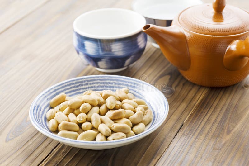 Green tea and peanuts stock photo. Image of seed, teapot - 27614066