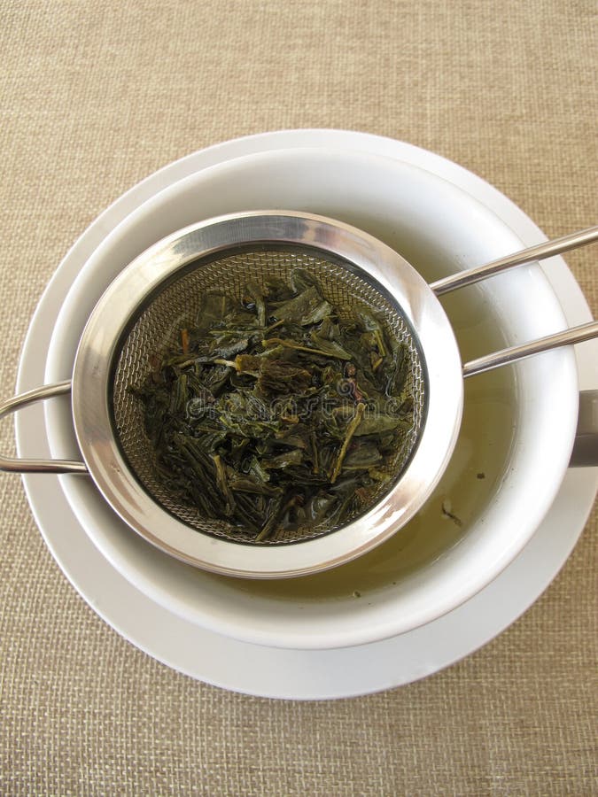 Green tea in tea strainer stock image. Image of drinking - 50250725