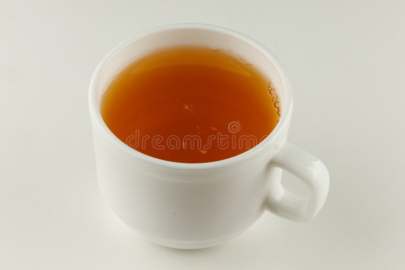 Green tea in a white cup stock photo. Image of plant - 253572430