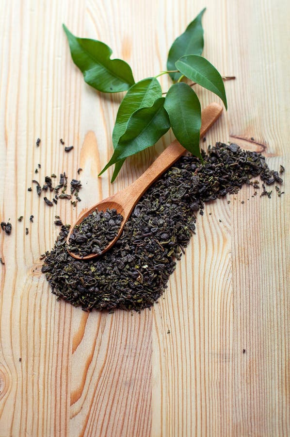 Green Tea In Wooden Spoon And Tea Leaves Stock Photo - Image of ...