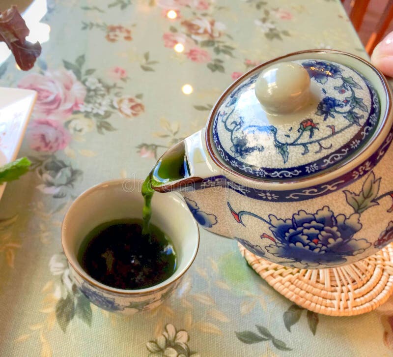 Green Teapot Pour stock photo. Image of food, shop, teapot - 68379614