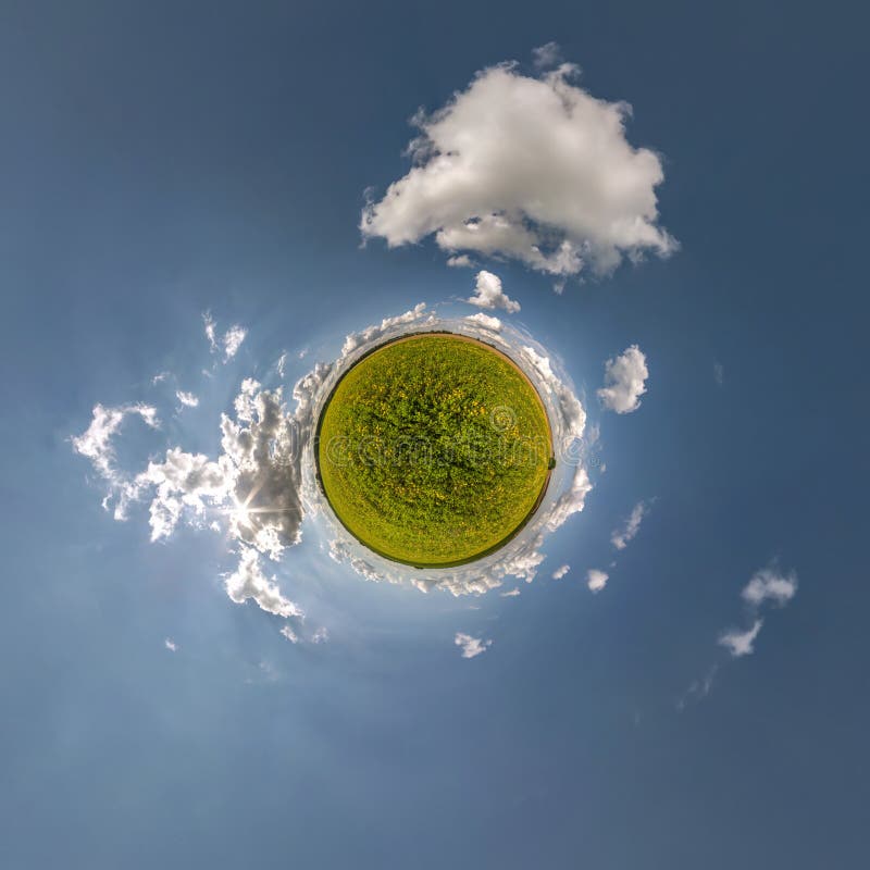 Green Tiny Planet in Blue Sky with Beautiful Clouds with Transformation ...