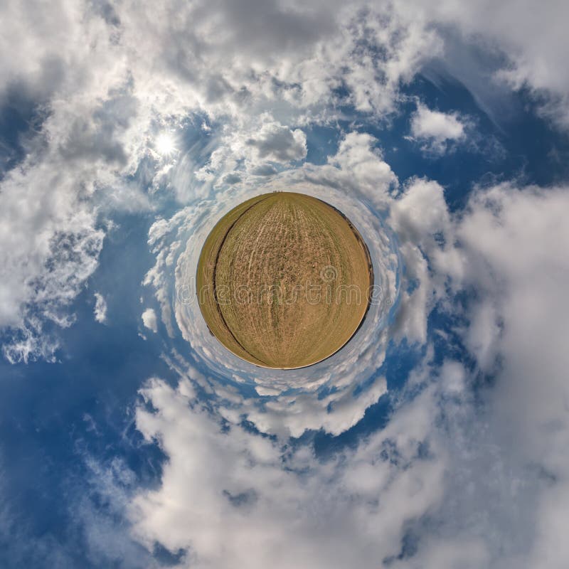 Green Tiny Planet in Blue Sky with Beautiful Clouds with Transformation ...