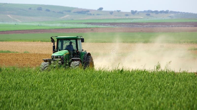 Green Tractor in the Field. Editorial Image - Image of nature, meadow ...