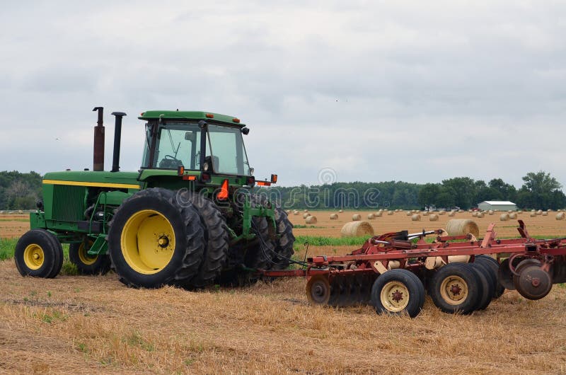 Green Tractor in Field editorial photo. Image of green - 43241316