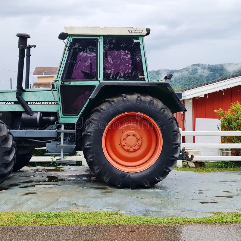 The Green Tractor is Parked in the Middle of the Farm. Stock Image ...